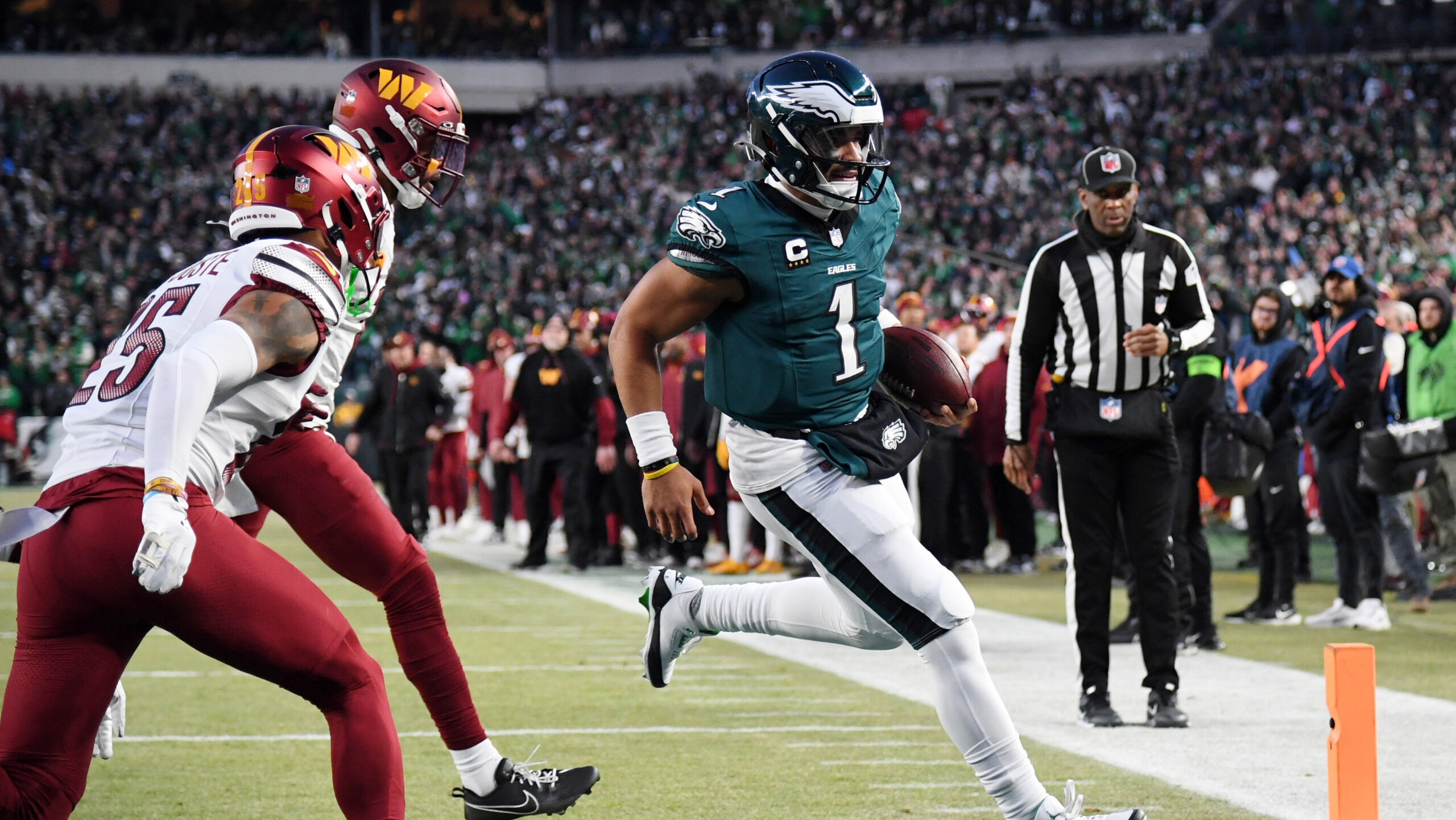 Jalen Hurts breaks playoff QB rushing TD record with 3 scores in NFC ...