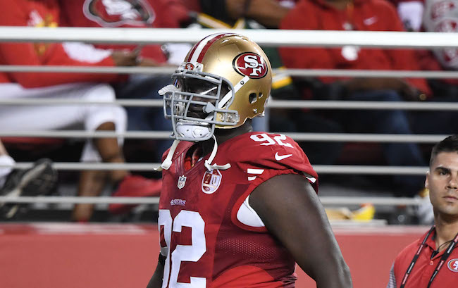 Photo: Former Alabama DL Quinton Dial helps troops hold flag before ...