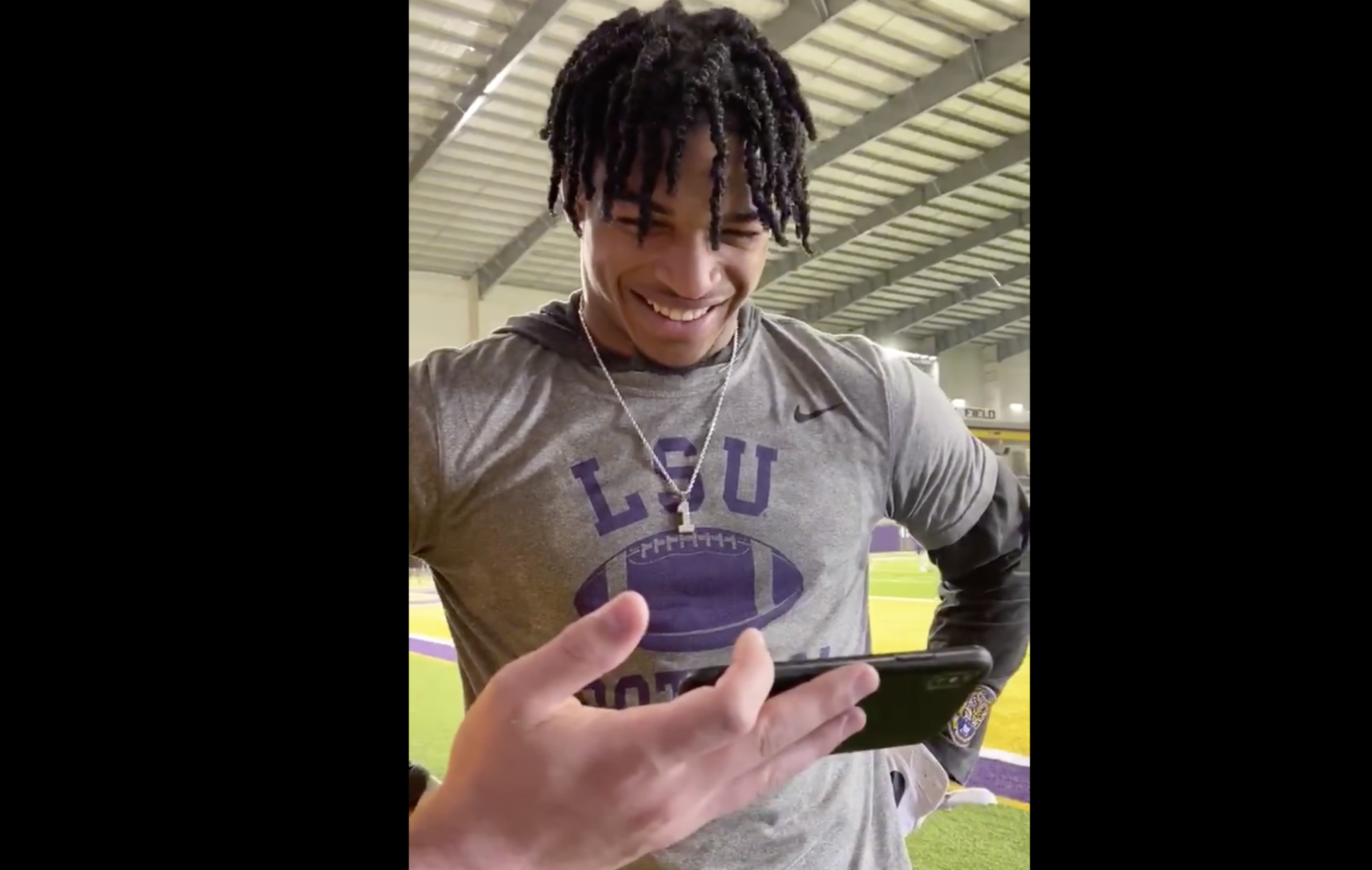 Ja'Marr Chase reacts after being shown LSU's No. 7 reveal video for the ...