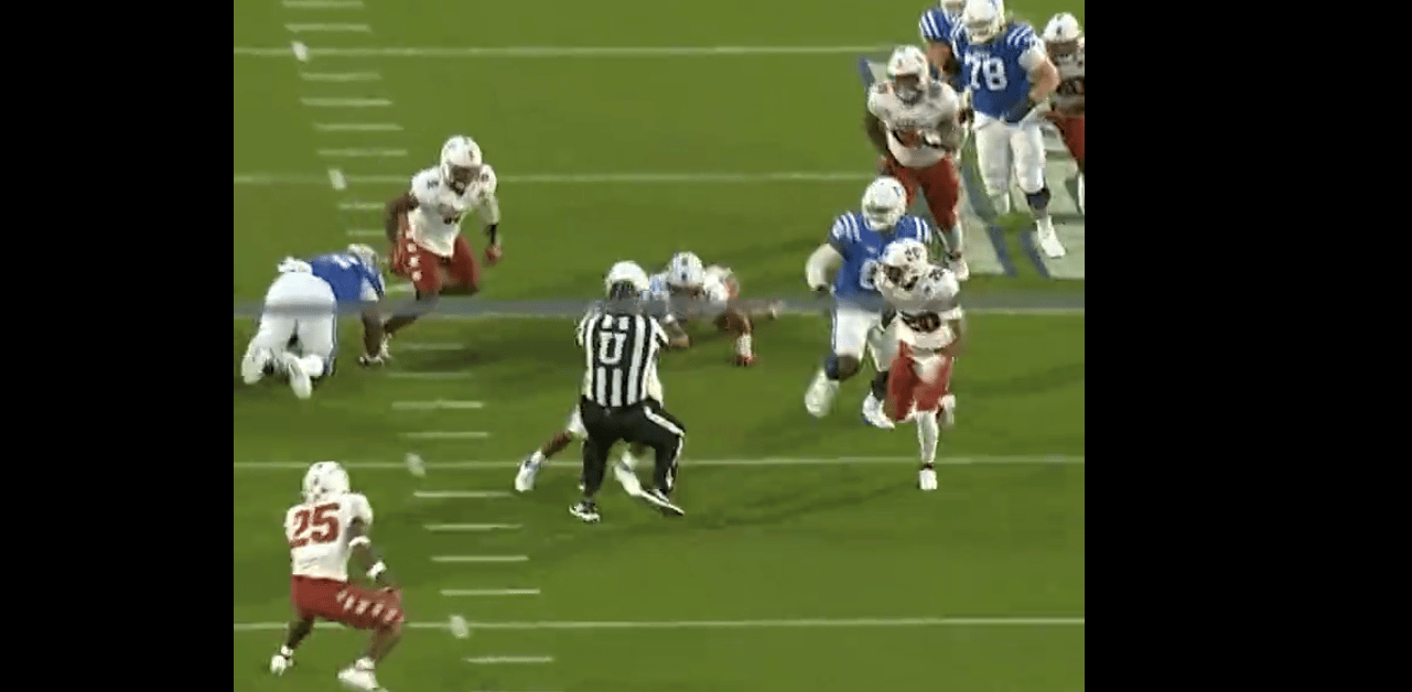 College football player sees game official in his way, runs him over