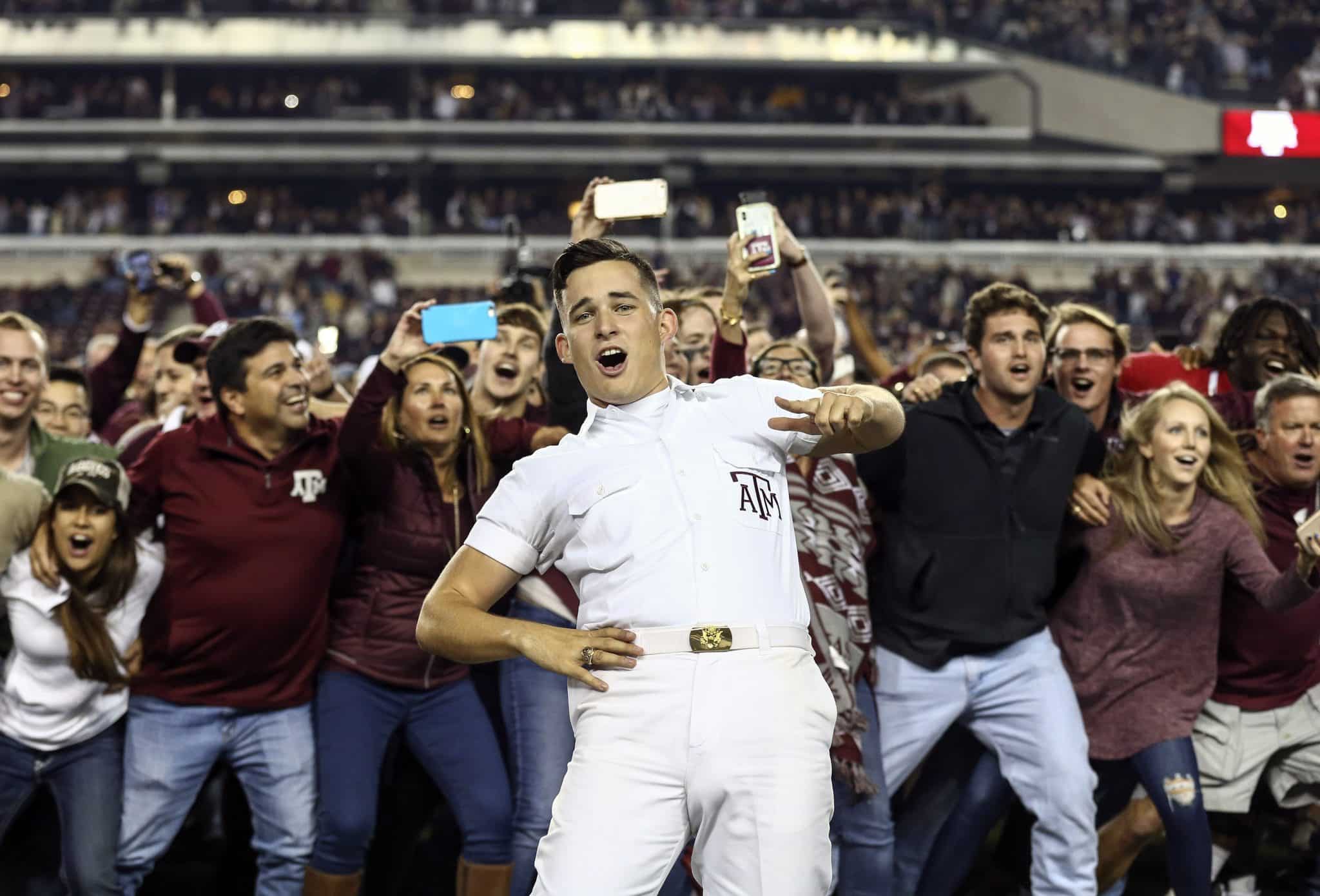 Texas A&M Yell Leaders get some practice in during halftime weather delay
